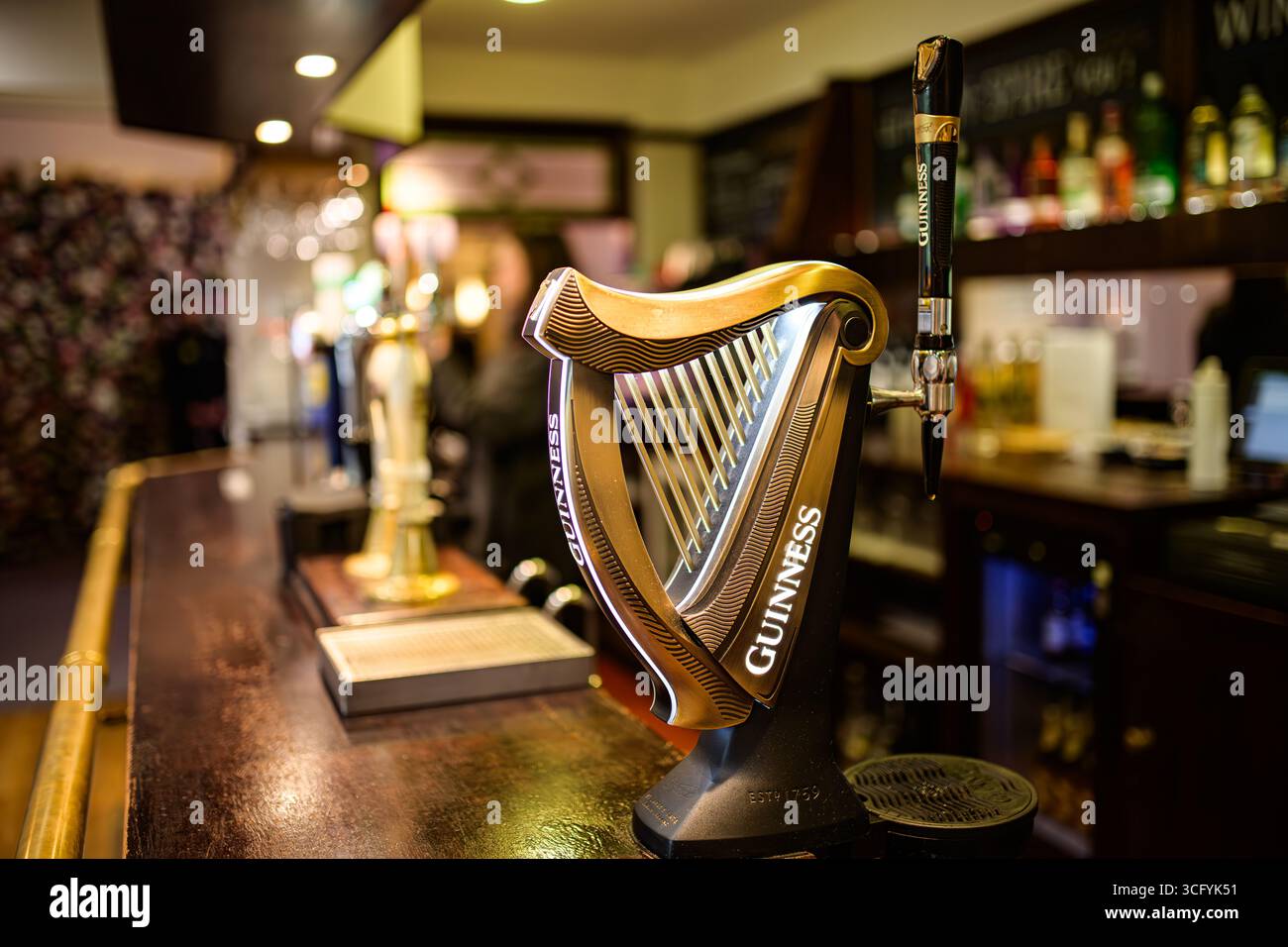 Original Guinness Harp beer dispenser Stock Photo - Alamy
