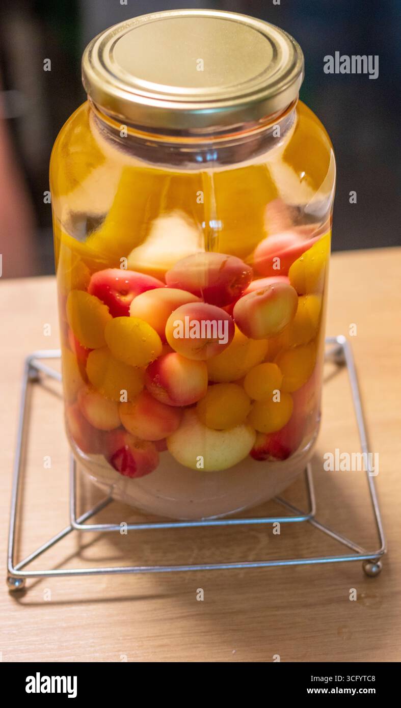 Canned compote in jars of various fruits and berries Stock Photo - Alamy