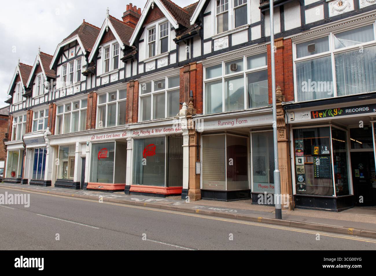 Shops on empty street hi-res stock photography and images - Alamy