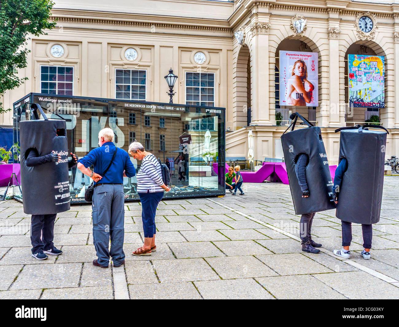 Actors from the "Volks Theater" (People's Theatre) dressed at dustbins ...