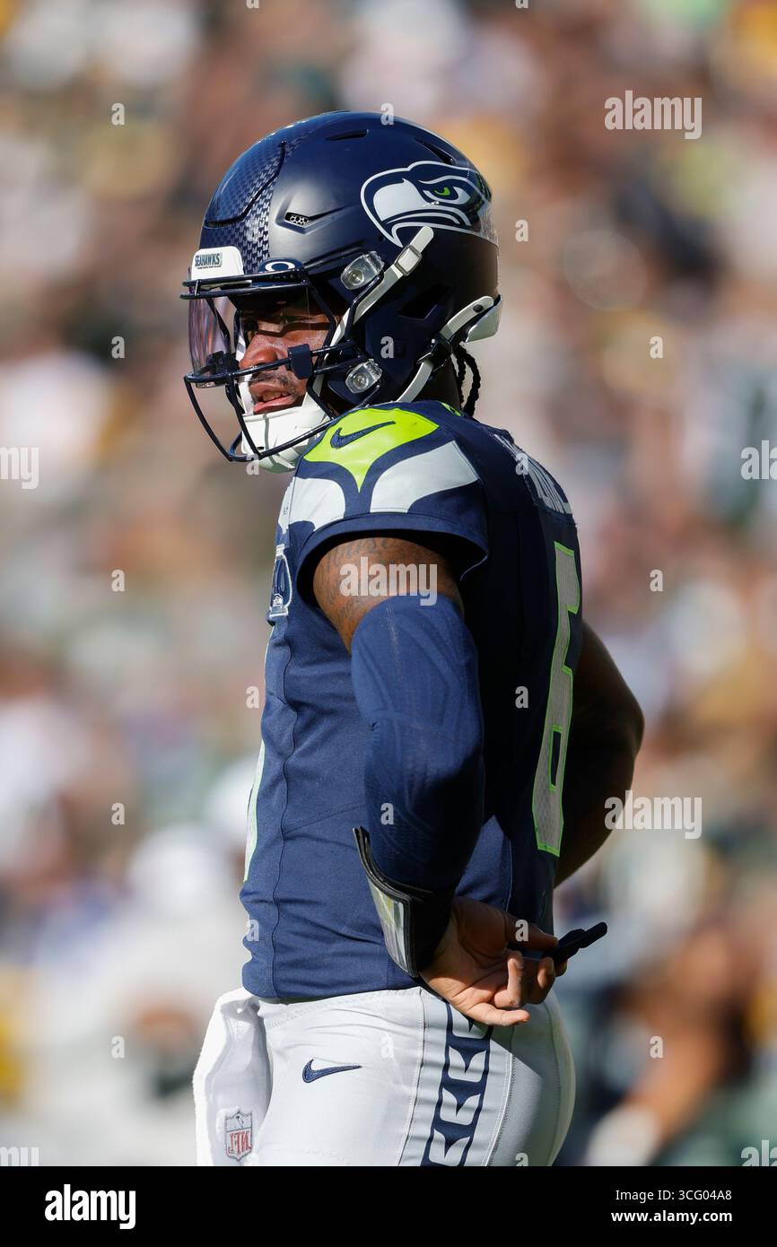 Seattle Seahawks quarterback Jalen Milroe (6) runs onto the field ...