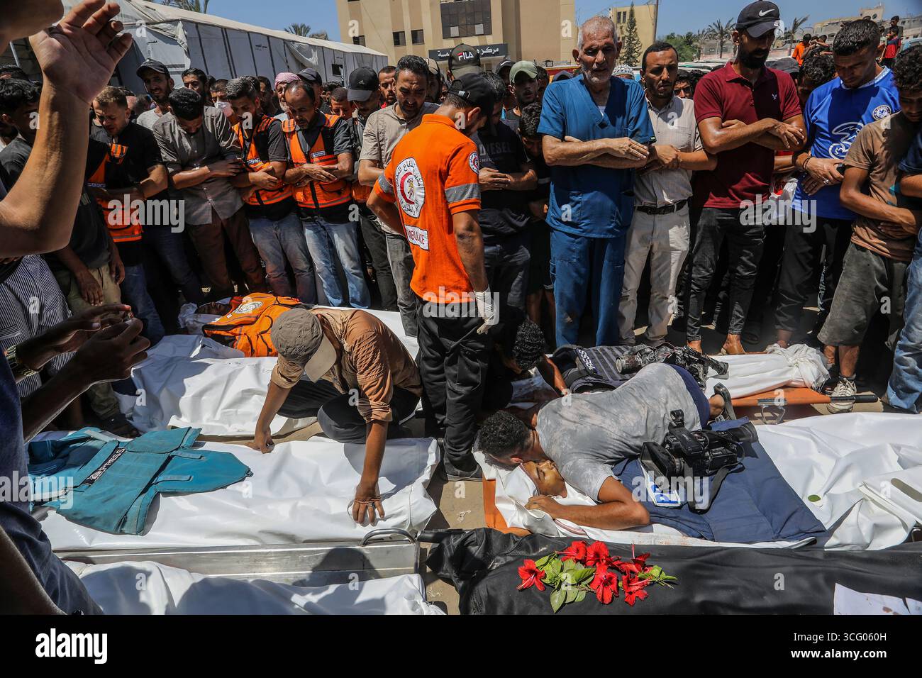 Palestinians mourners attend the funeral of Reuters photojournalist Hossam al-Masry, Al Jazeera ...
