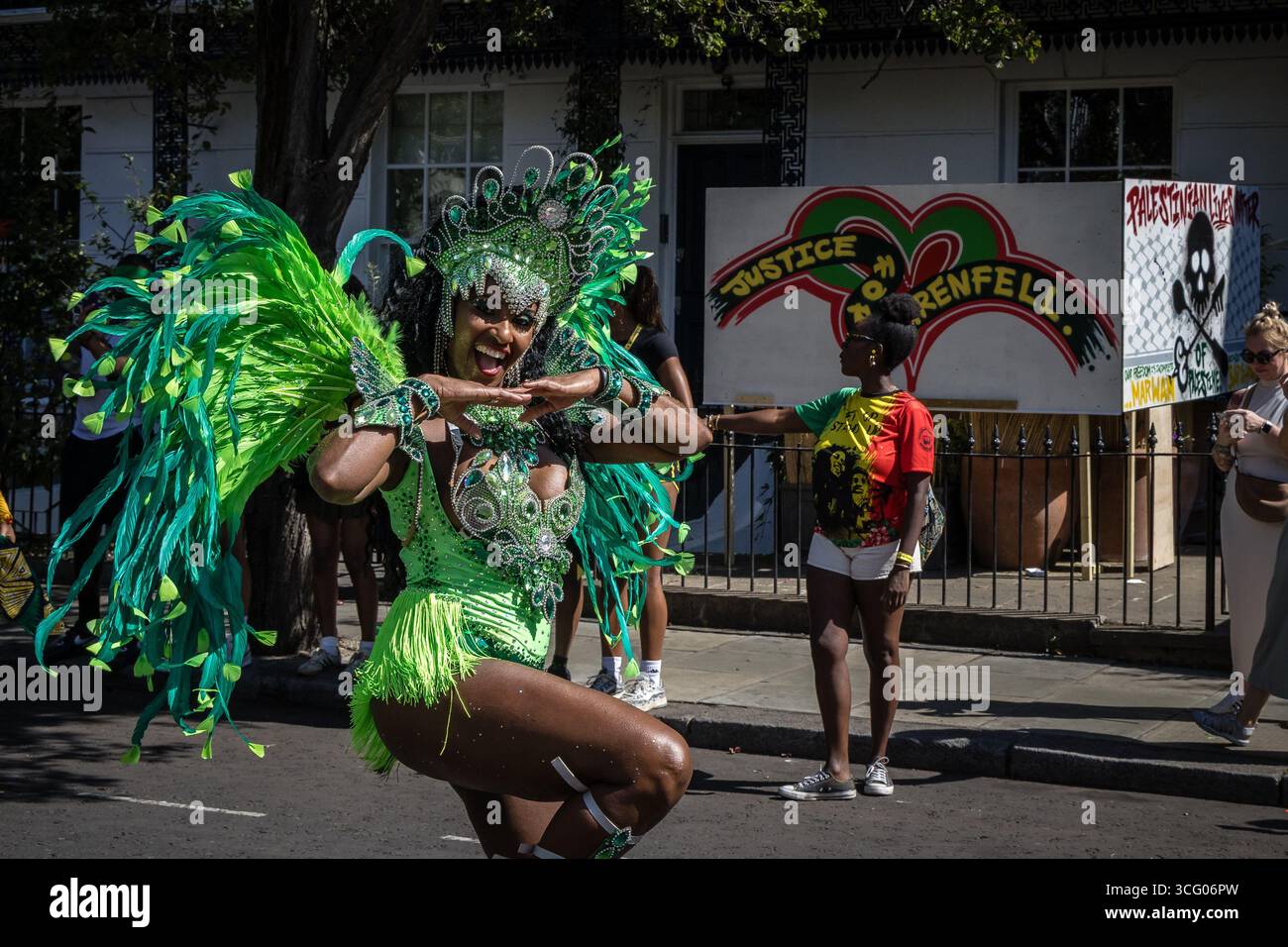 LONDON, UK - 25 Aug 2025: Performers in vibrant costumes and Brazilian ...