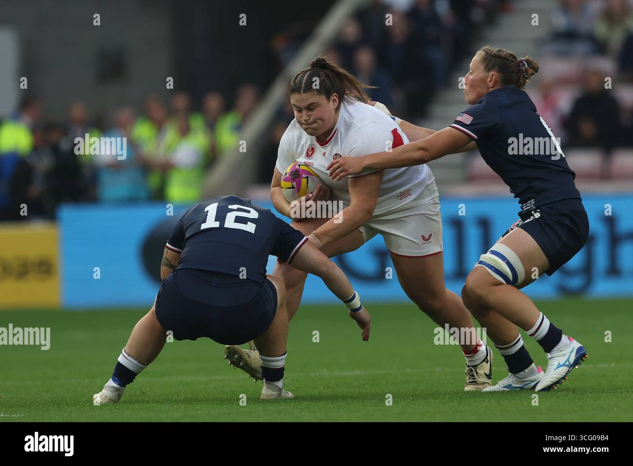 England's Maud Muir in action with USA's Alev Kelter and Kate Zachary ...