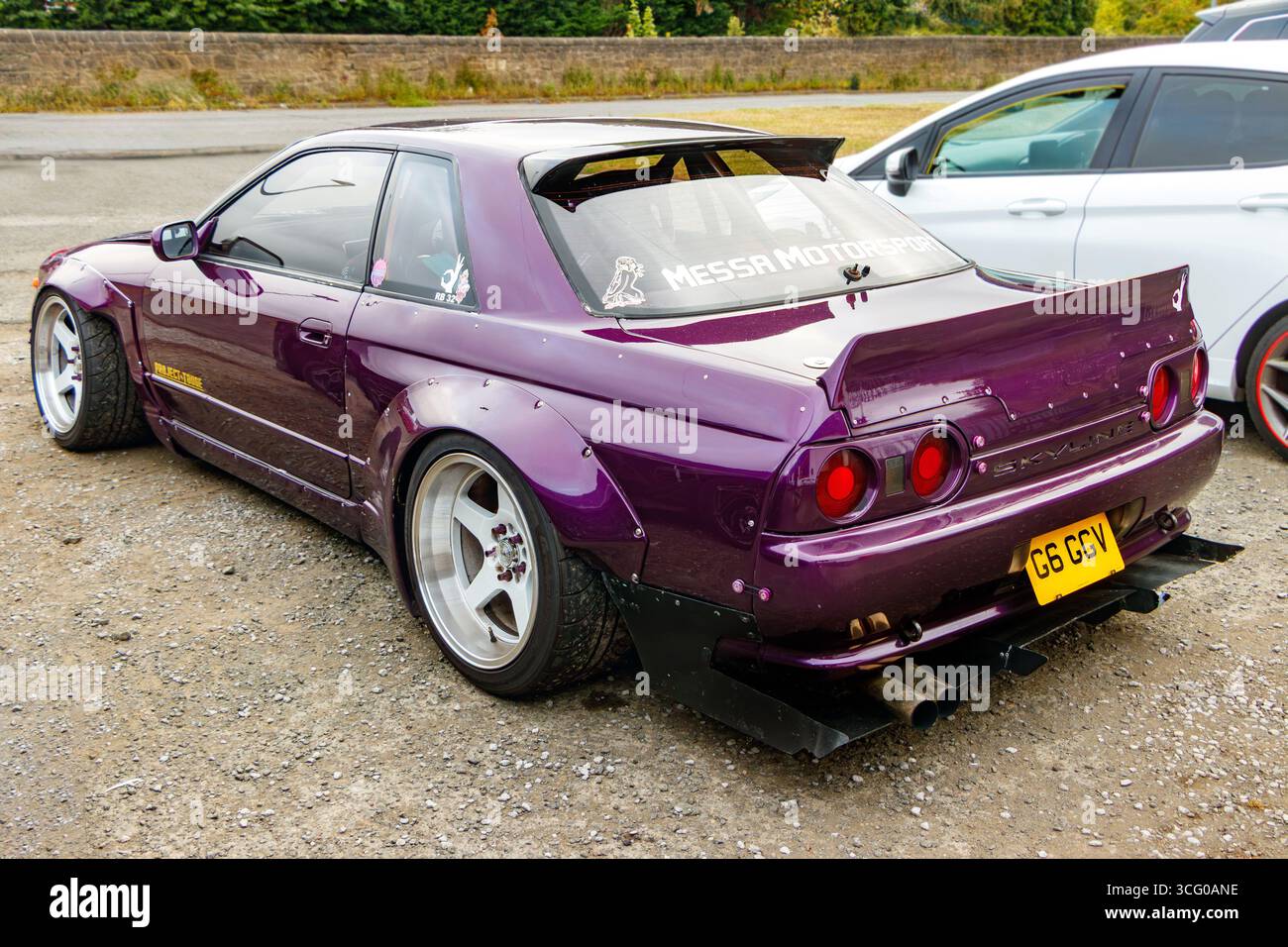 Purple modified nissan skyline R32 sports car with wide wheels and ...