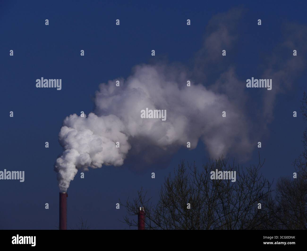 Large stack of smoke is rising from a factory Stock Photo - Alamy