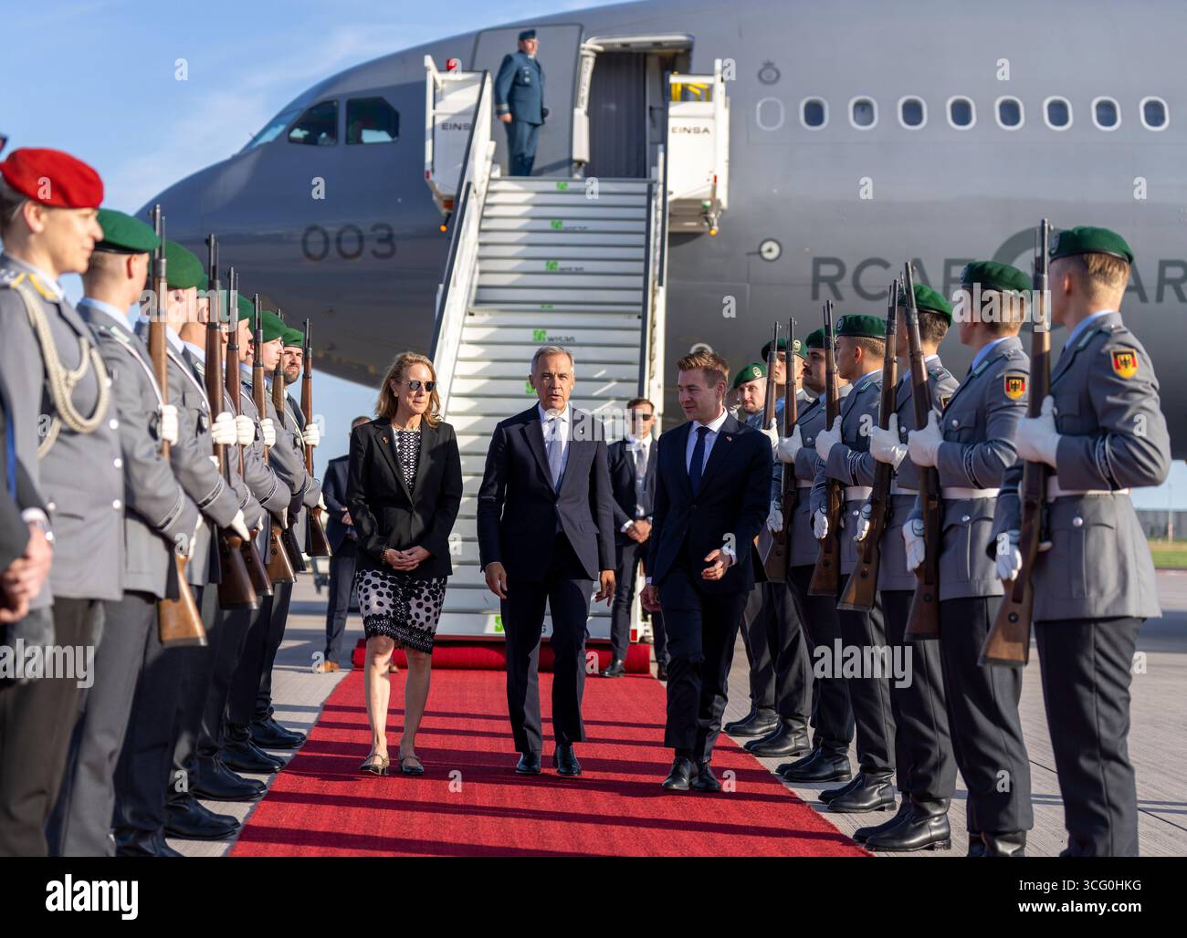 Canada Prime Minister Mark Carney, centre, is met by a welcoming ...