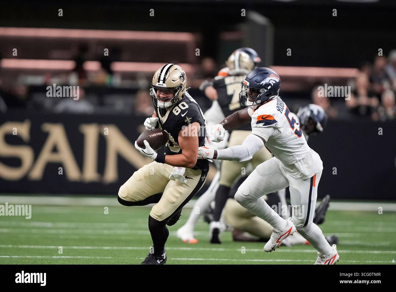 New Orleans Saints tight end Moliki Matavao (80) carries against Denver ...