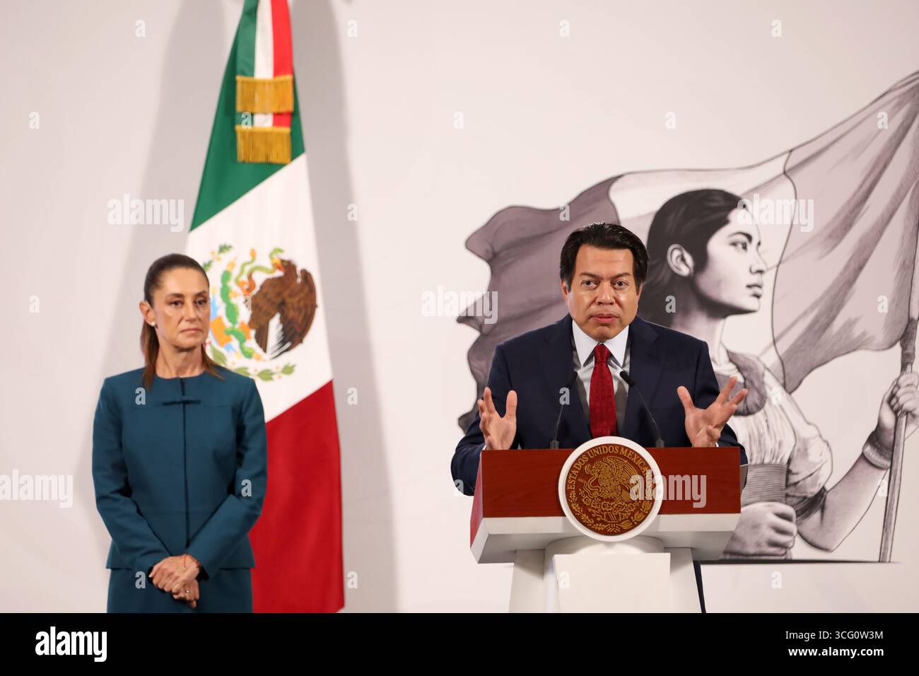 Mexico’s President Claudia Sheinbaum Pardo is seen behind while Mexico ...