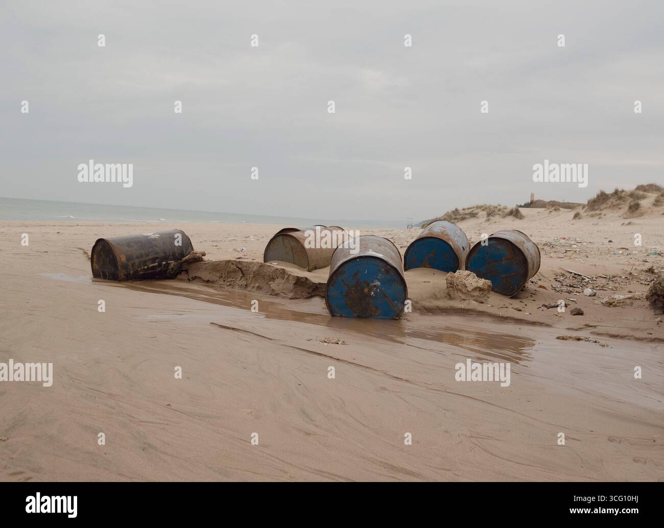 Seaside scene with industrial pollution under a grey sky Stock Photo ...