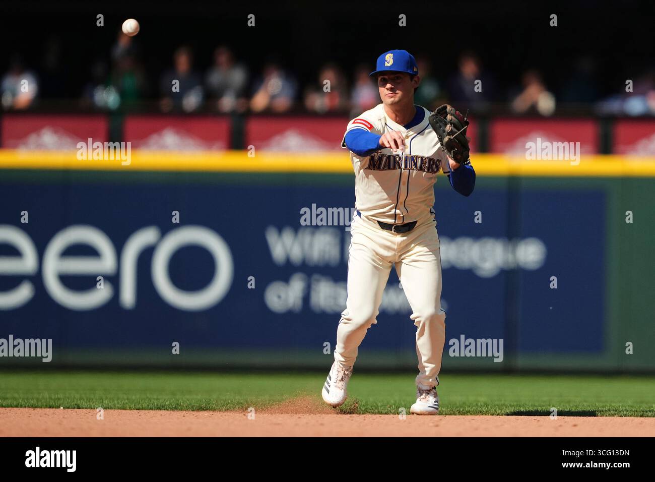 Seattle Mariners' Cole Young makes a throw to first base against the ...