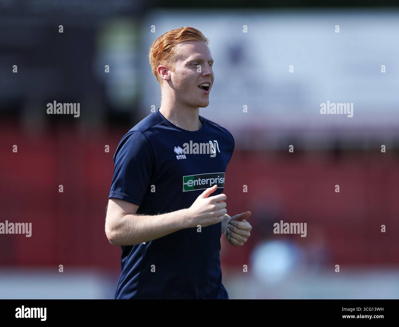 zTamworth, UK. 25th August 2025. Ryan Haynes of Brackley Town warms up ...