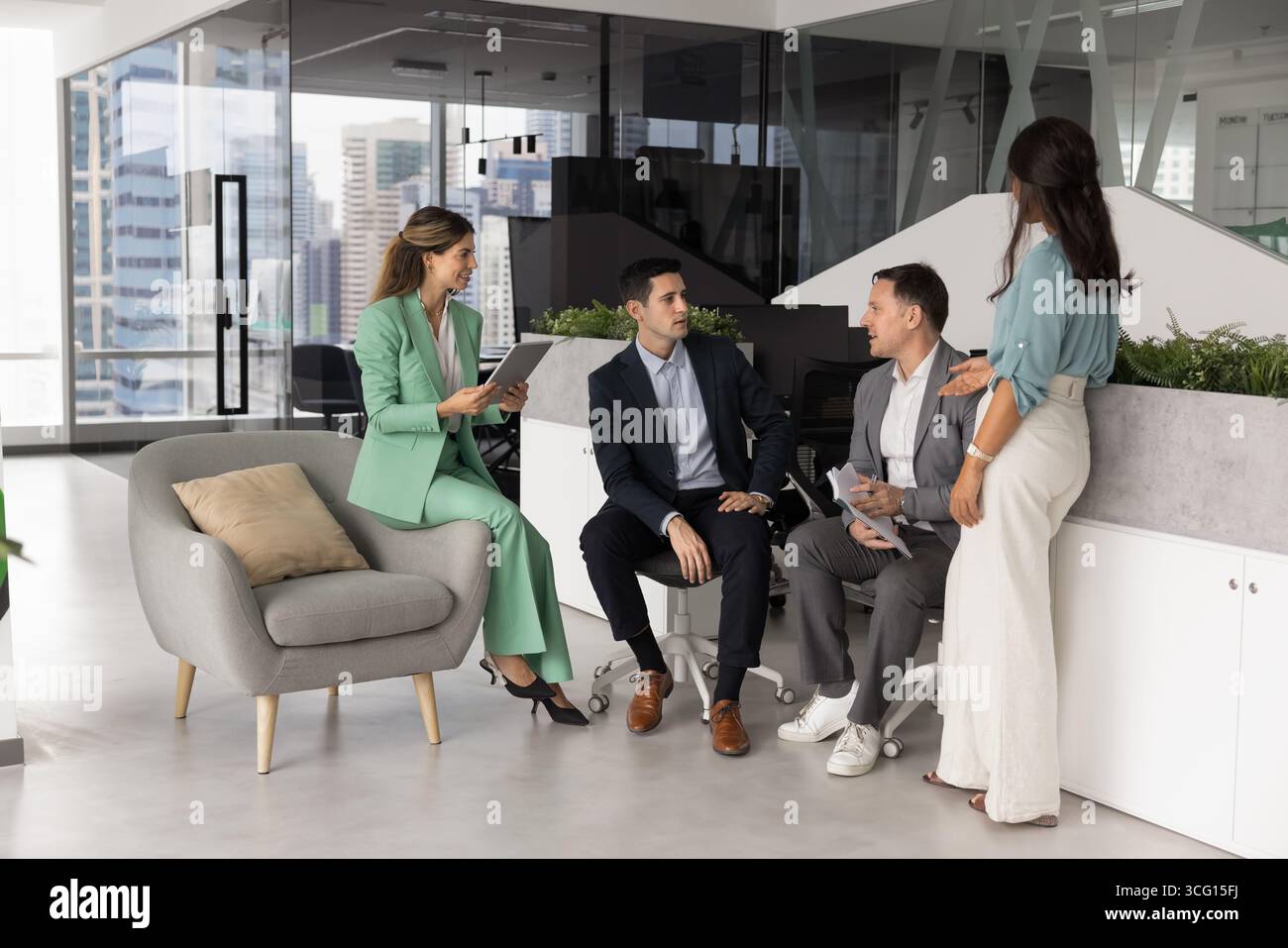 Teammates of marketing department gathered in office engaged in ...