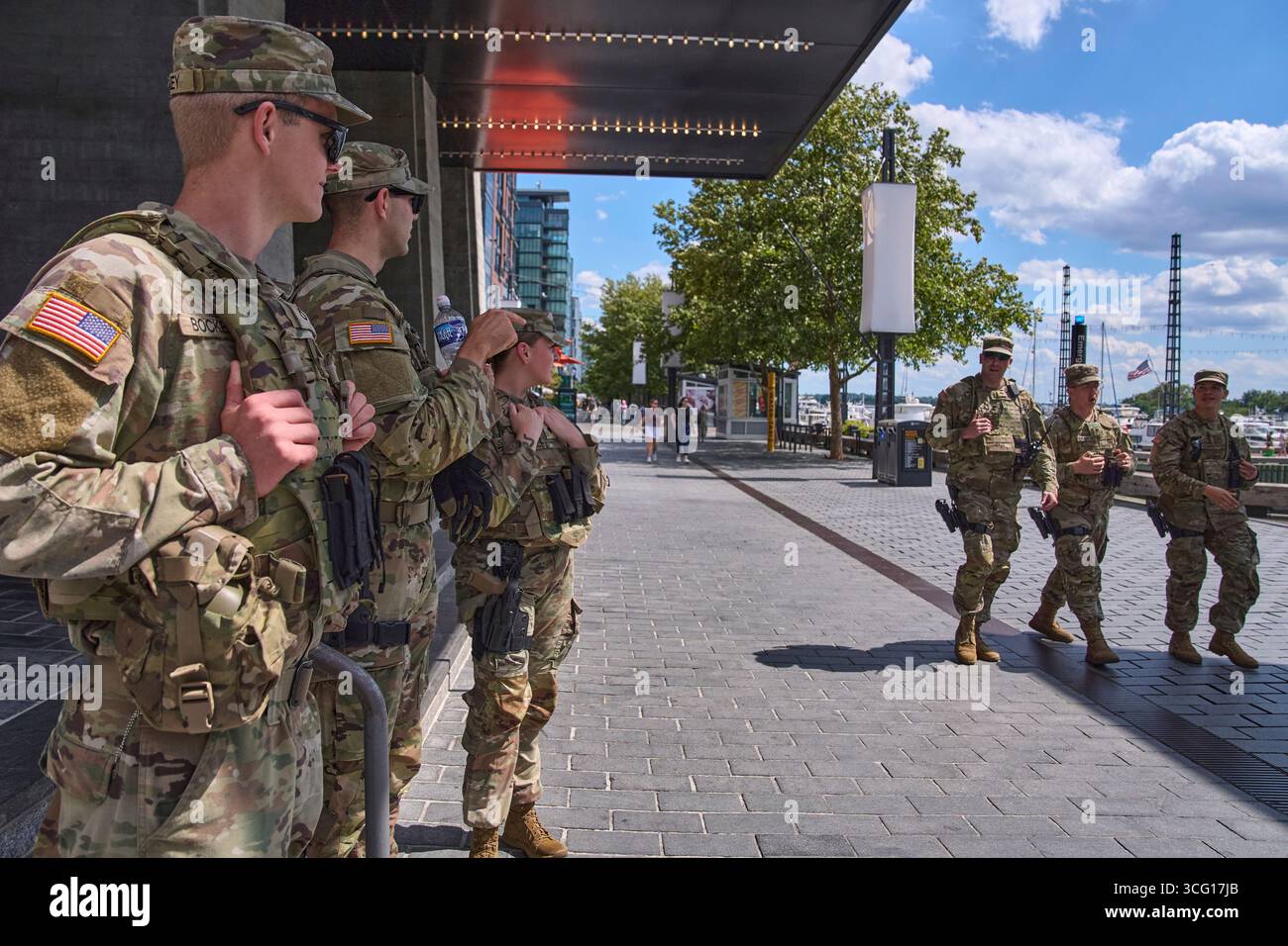 Armed members of the Ohio National Guard patrol at The Wharf, Monday ...