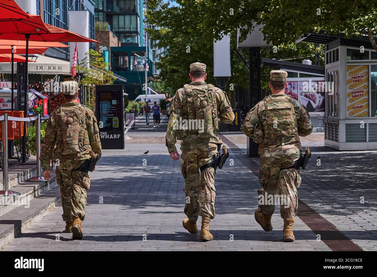 Armed members of the Ohio National Guard patrol The Wharf, Monday, Aug ...