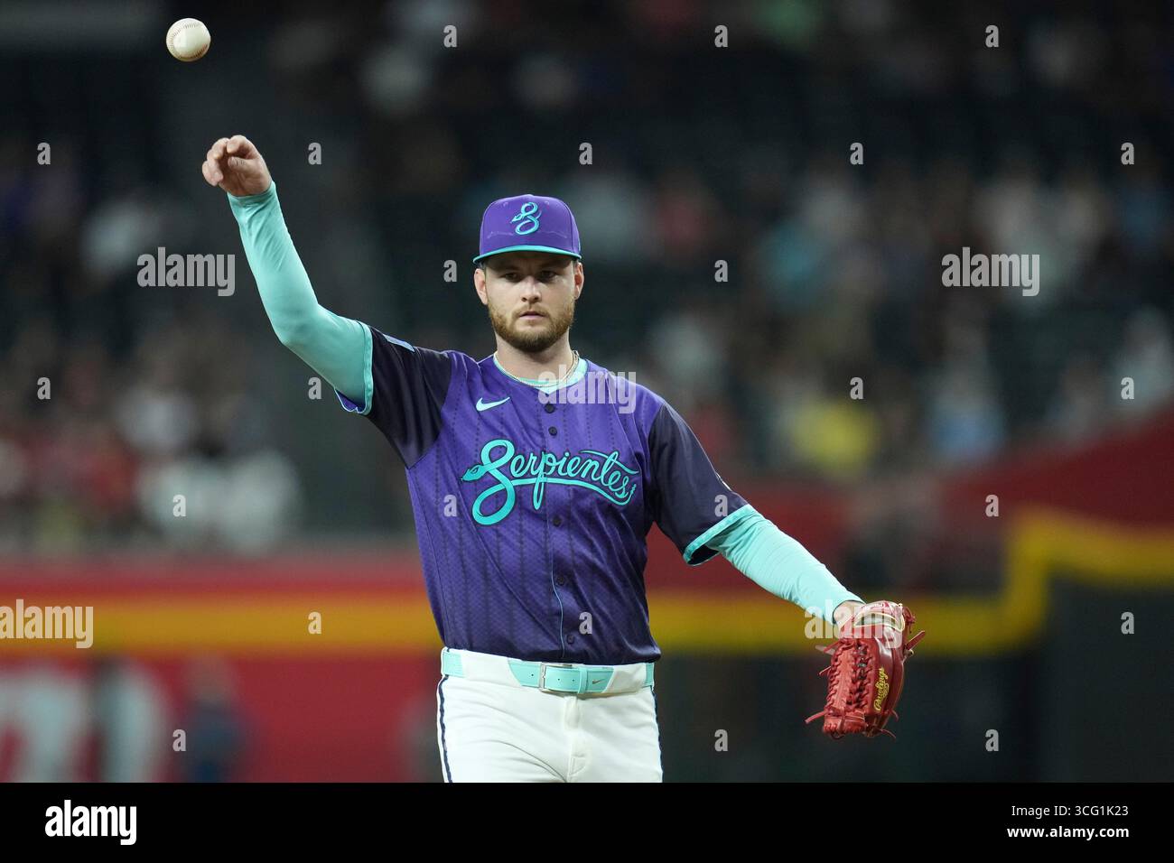 Arizona Diamondbacks starting pitcher Ryne Nelson tosses a ball out of ...
