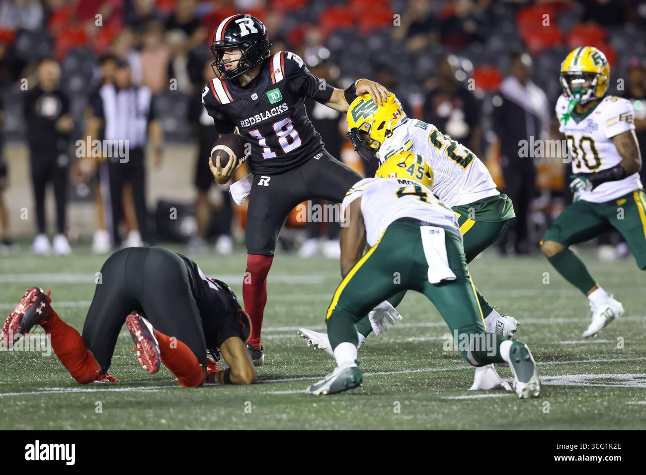 August 22, 2025: Ottawa Redblacks quarterback Dustin Crum (18) attempts ...