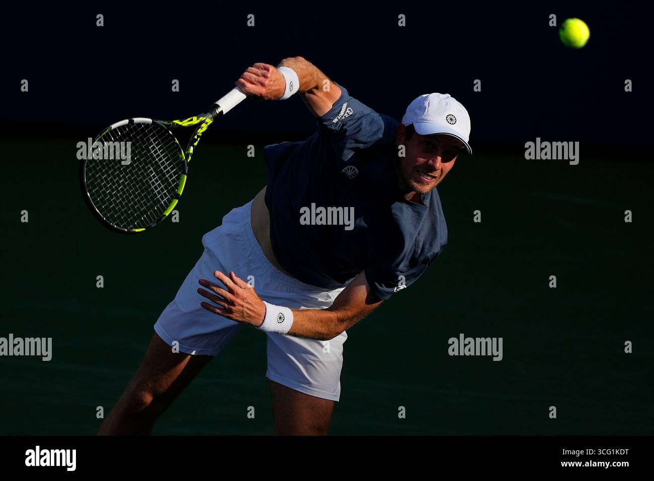 Botic van De Zandschulp, of the Netherlands, serves to Holger Rune, of ...