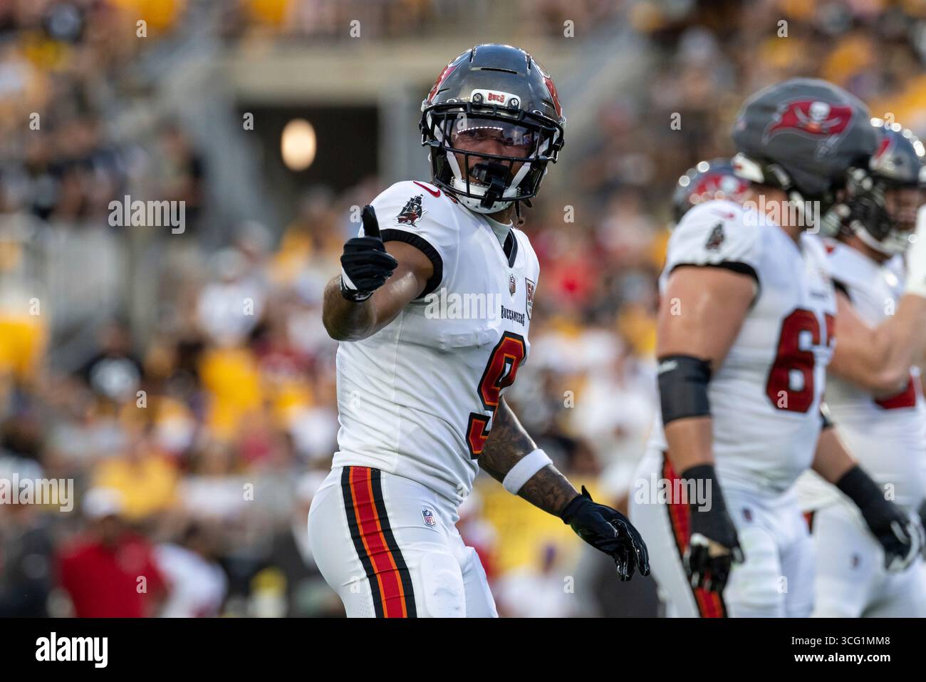 Tampa Bay Buccaneers wide receiver Emeka Egbuka (9) signals during a ...