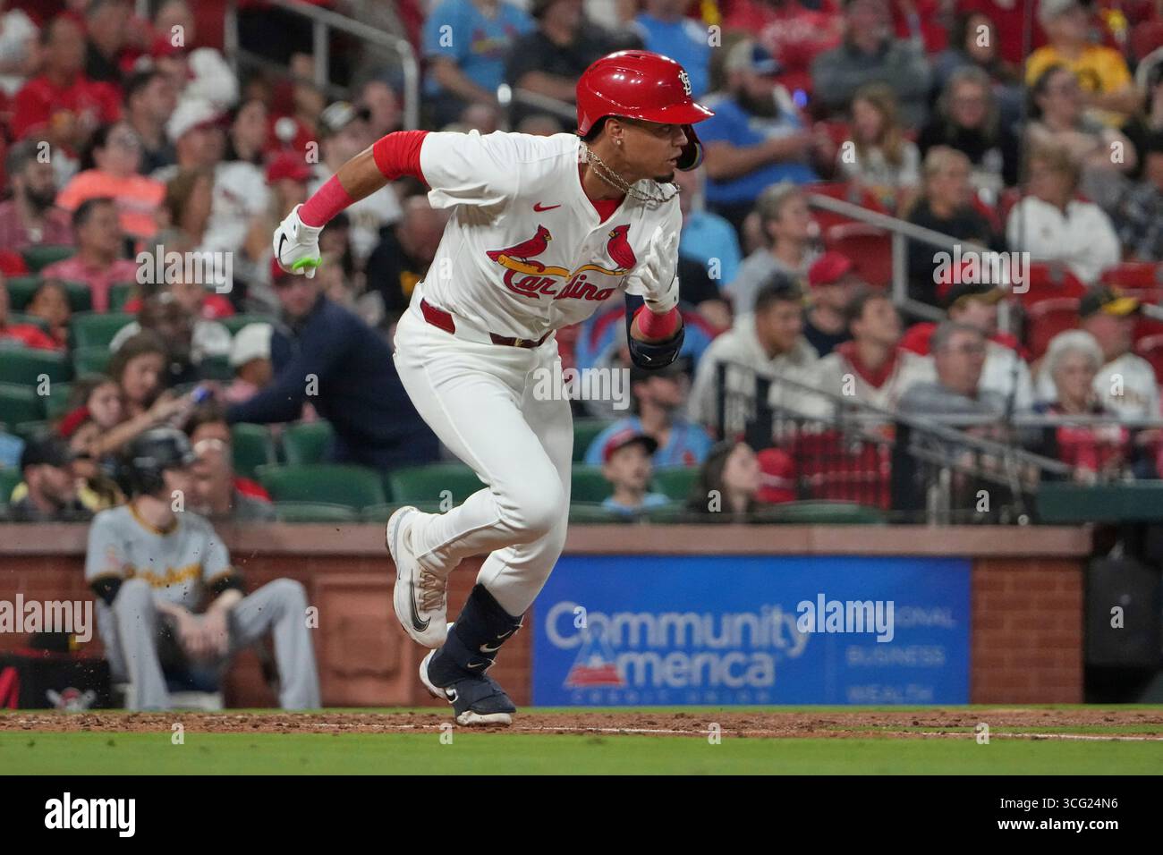 St. Louis Cardinals' Masyn Winn heads to first on an RBI single during ...