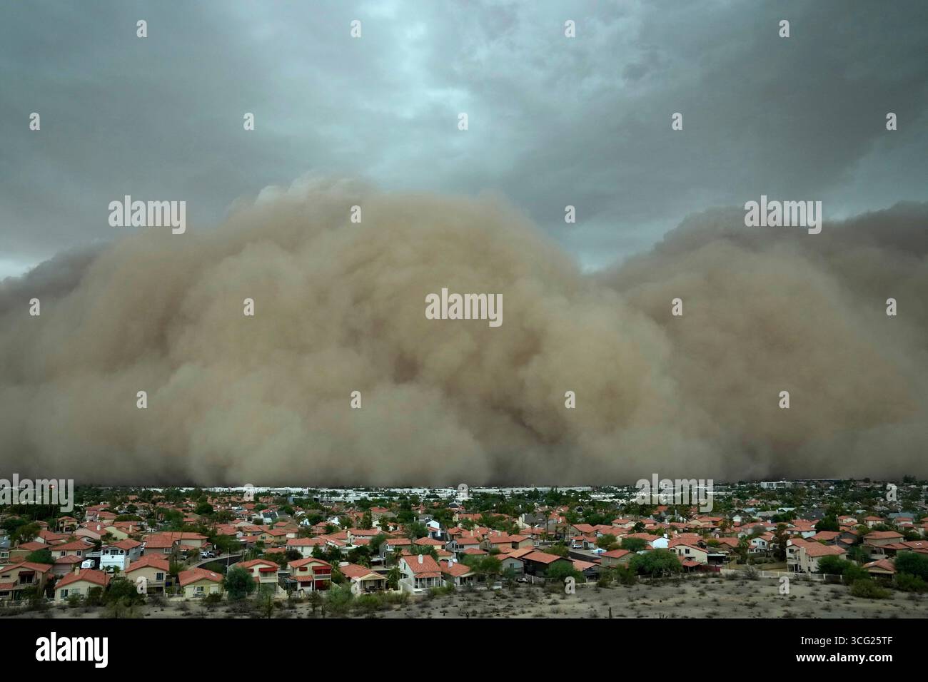 A giant dust storm approaches the Phoenix metro area as a monsoon storm ...
