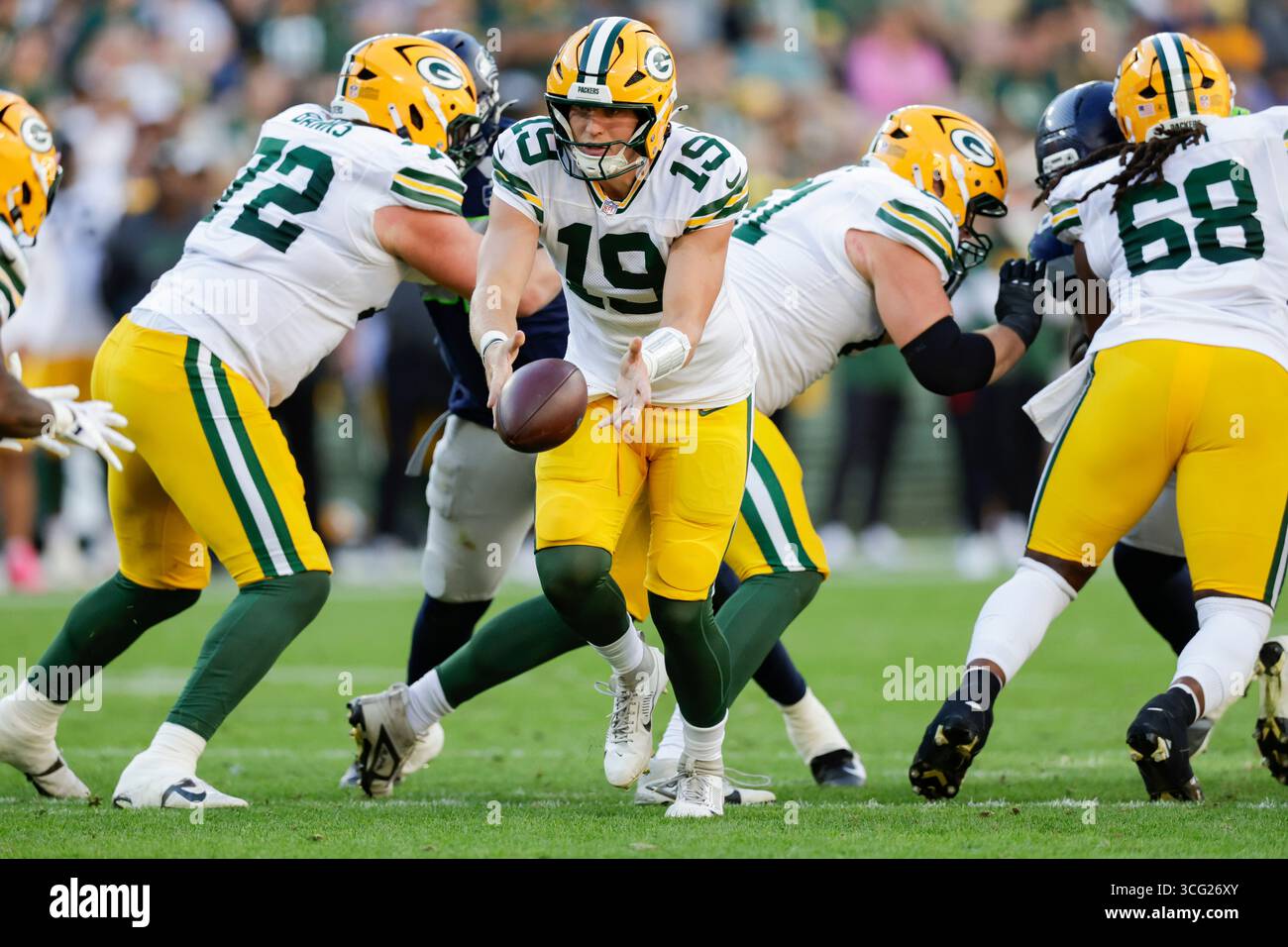 Green Bay Packers quarterback Taylor Elgersma (19) pitches the ball ...