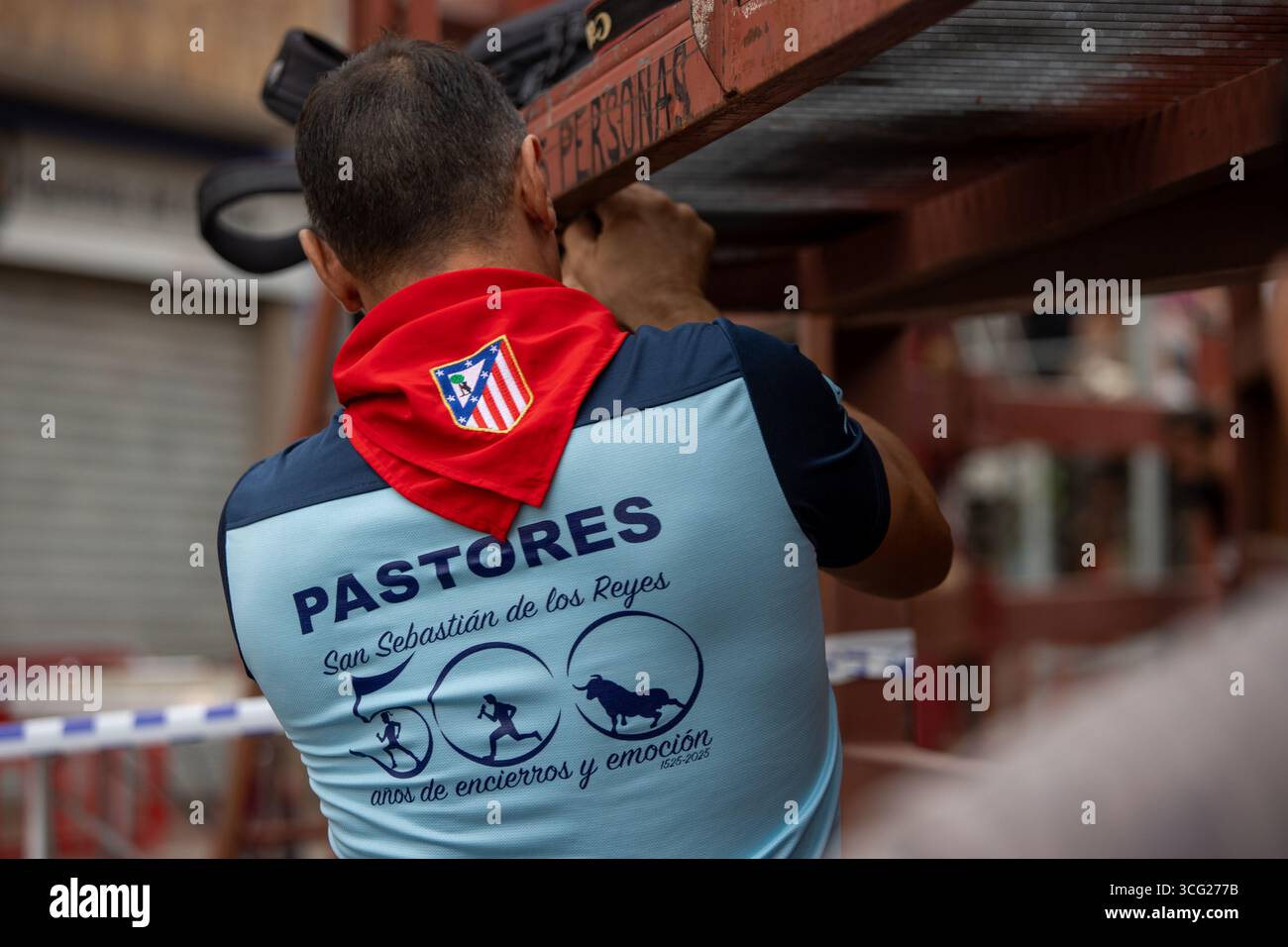 A shepherd wears a handkerchief with the Atlético de Madrid football ...