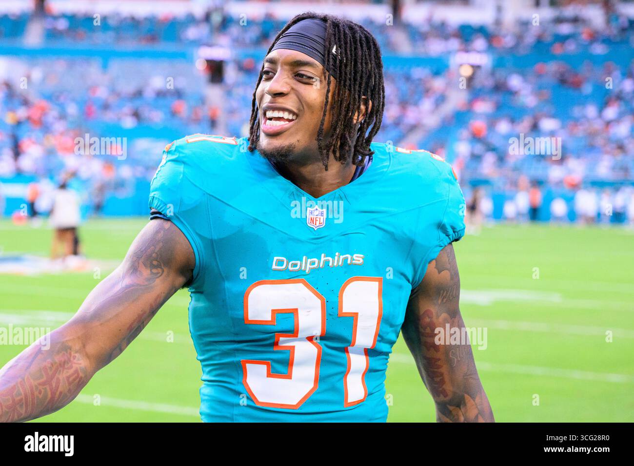 Miami Dolphins running back Ollie Gordon II (31) smiles on the sidelins ...