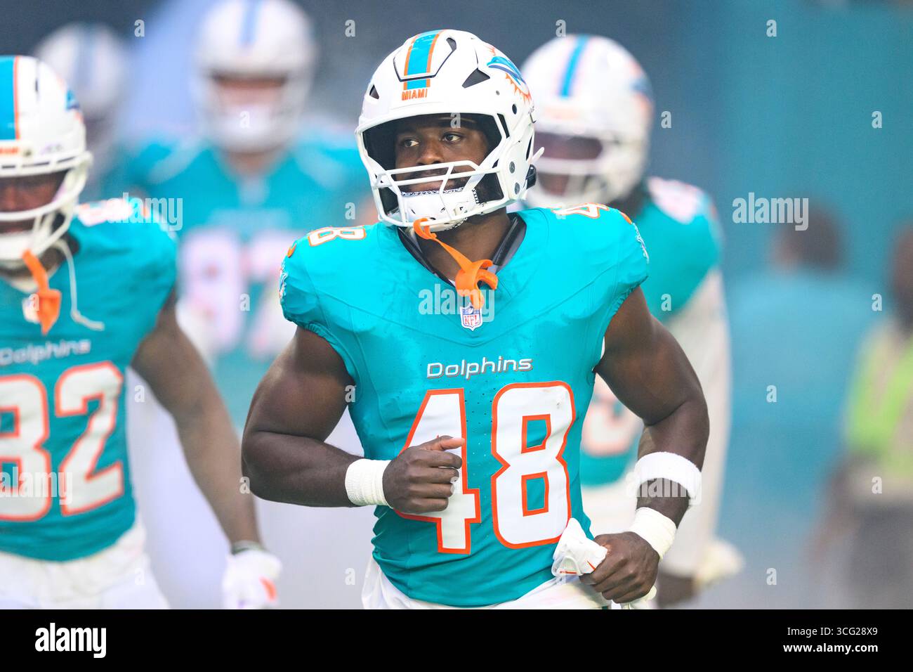 Miami Dolphins running back Aaron Shampklin (48) runs onto the field ...