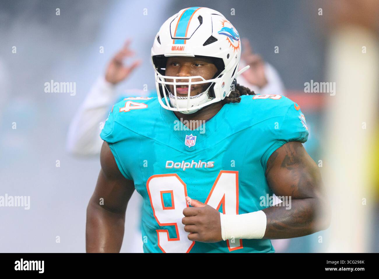 Miami Dolphins defensive tackle Jordan Phillips (94) runs onto the ...