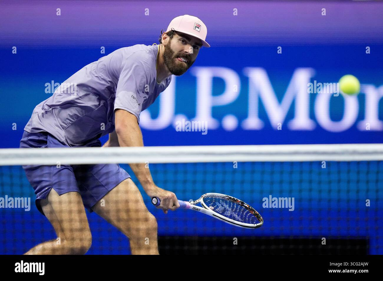 Reilly Opelka, of the United States, returns a shot to Carlos Alcaraz ...