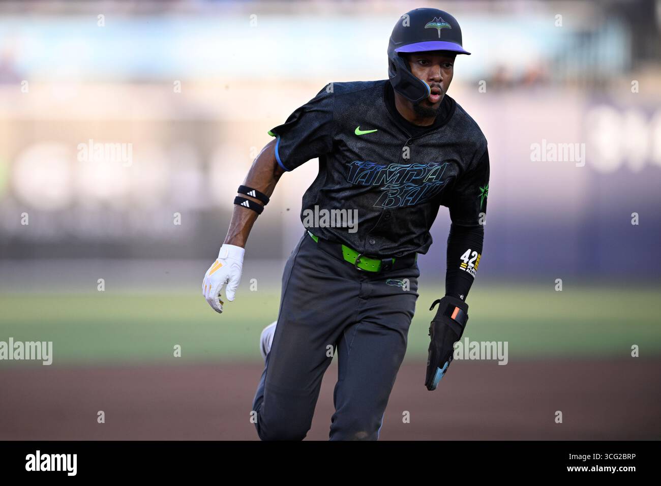 Tampa Bay Rays' Chandler Simpson heads to third base on a fly out by ...