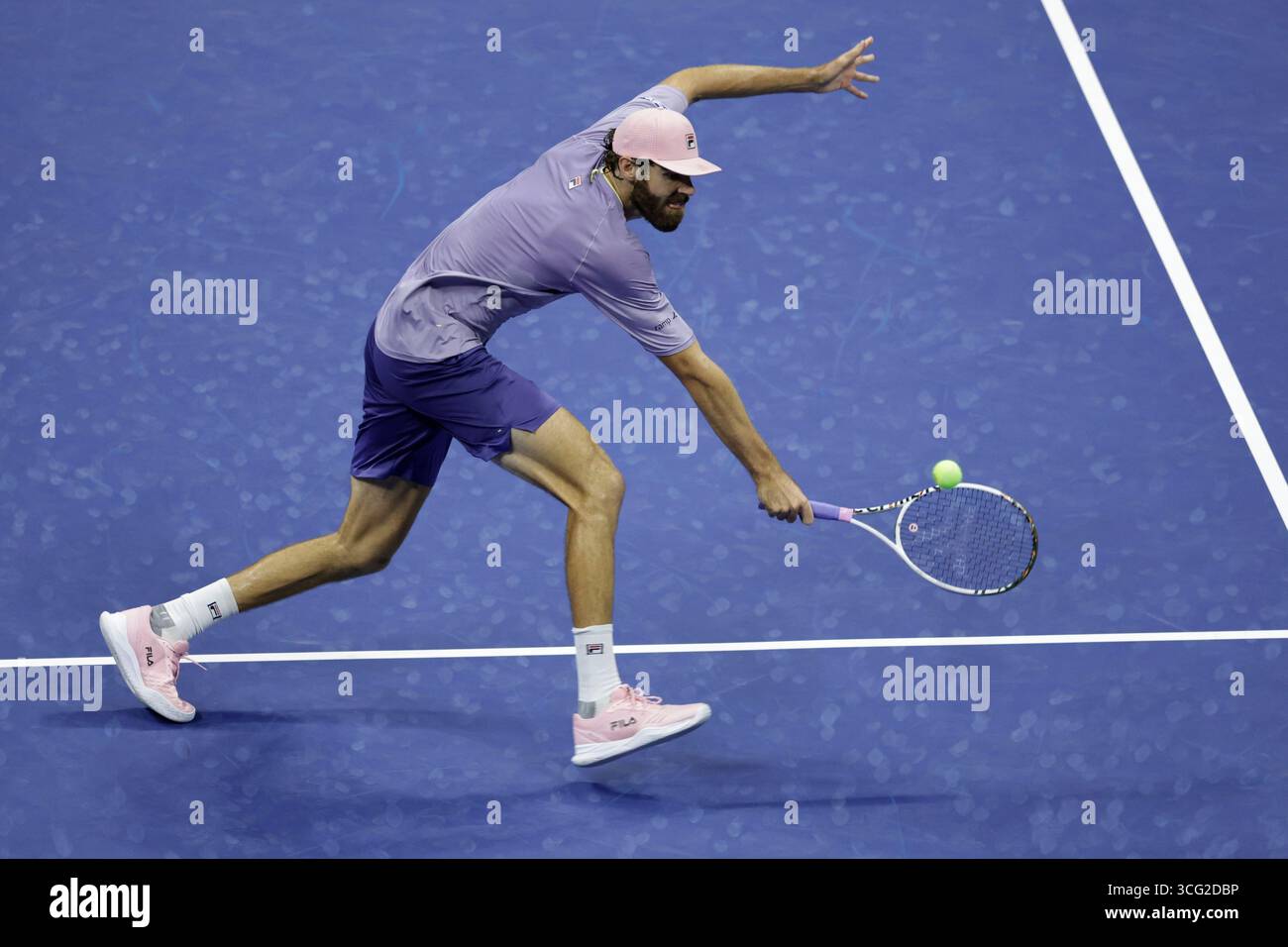 Reilly Opelka, of the United States, returns a shot to Carlos Alcaraz ...