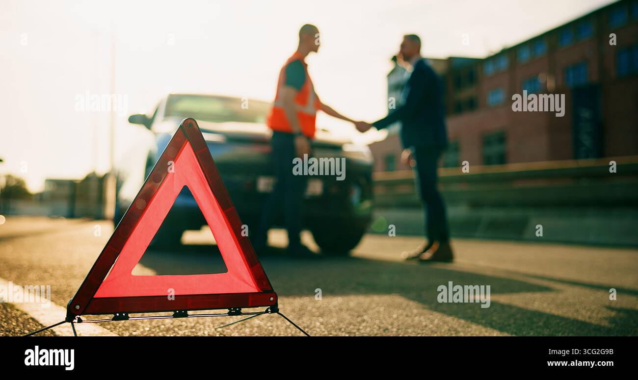 Warning sign, handshake and roadside assistance with man for car ...