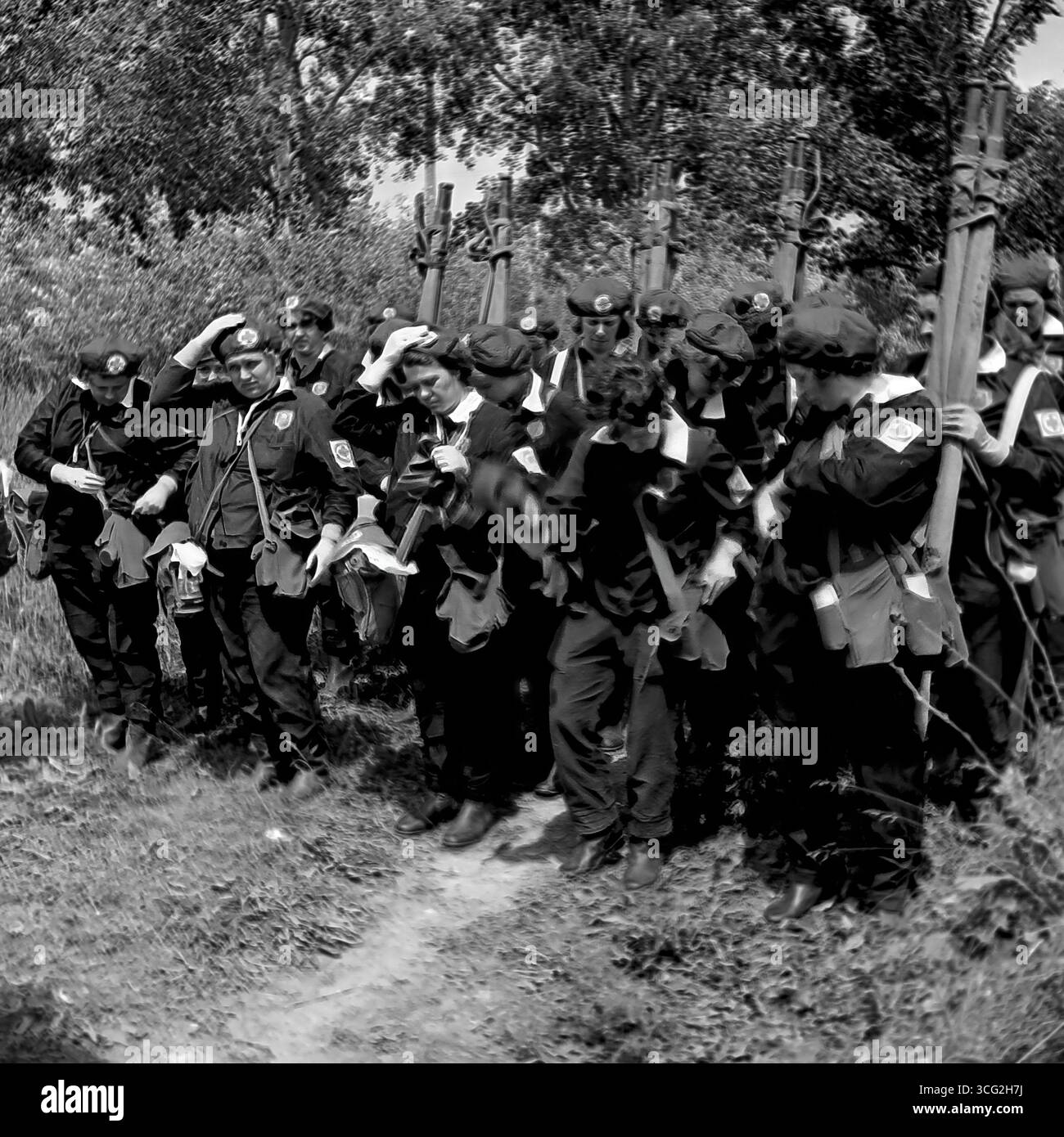 Archival photo of a female sanitary squad marching with stretchers ...