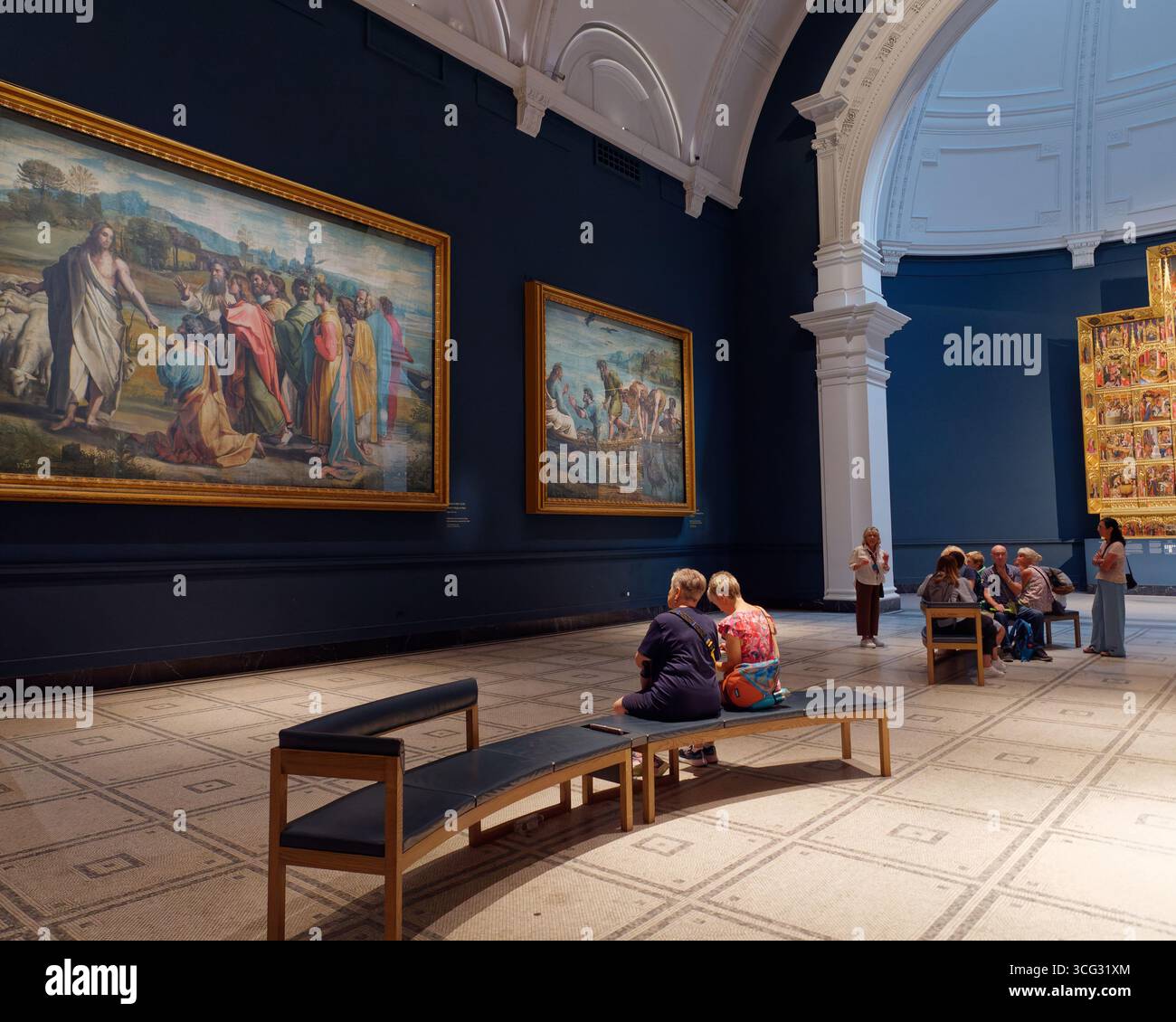 Visitors admire artwork inside the V&A Museum in London. August 25 ...