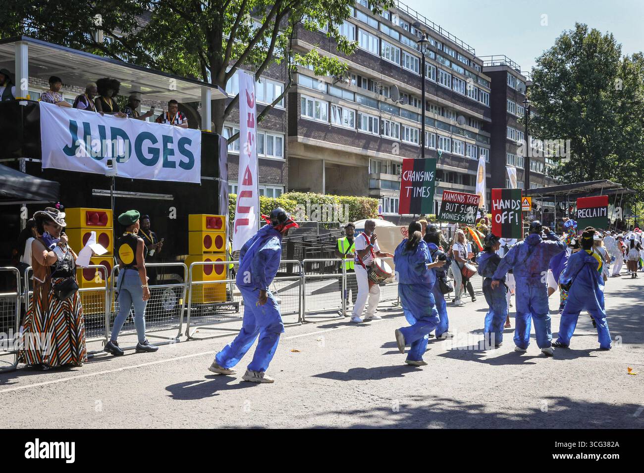 London, UK, 25th Aug 2025. A performance group highlight diamond mining ...