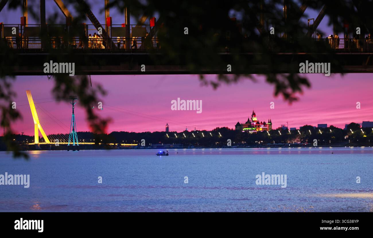 Sunset illuminates the sky over the Songhua River in Harbin City ...