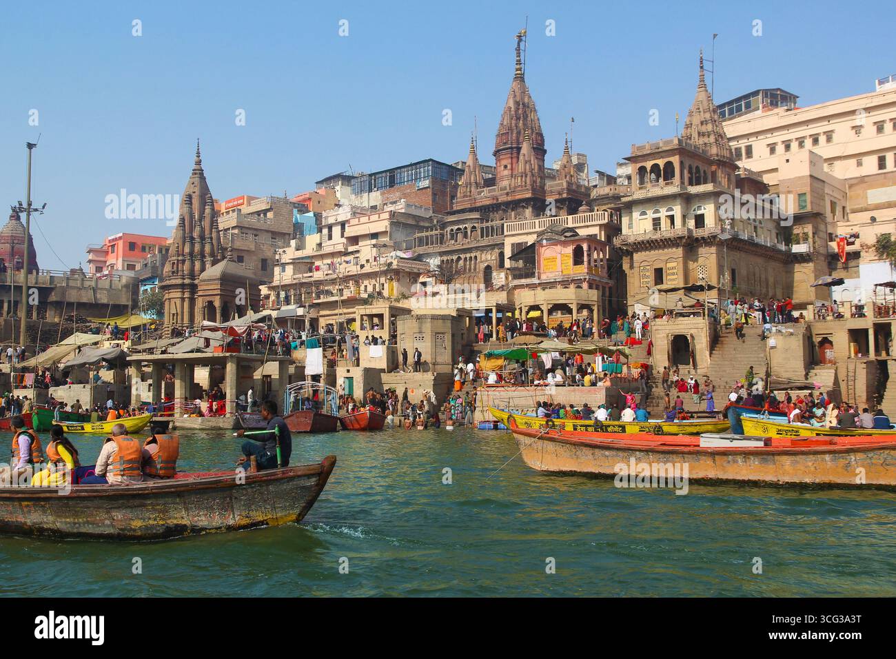 Lots of indian pilgrims on the boats and ghats of the sacred Varanasi ...
