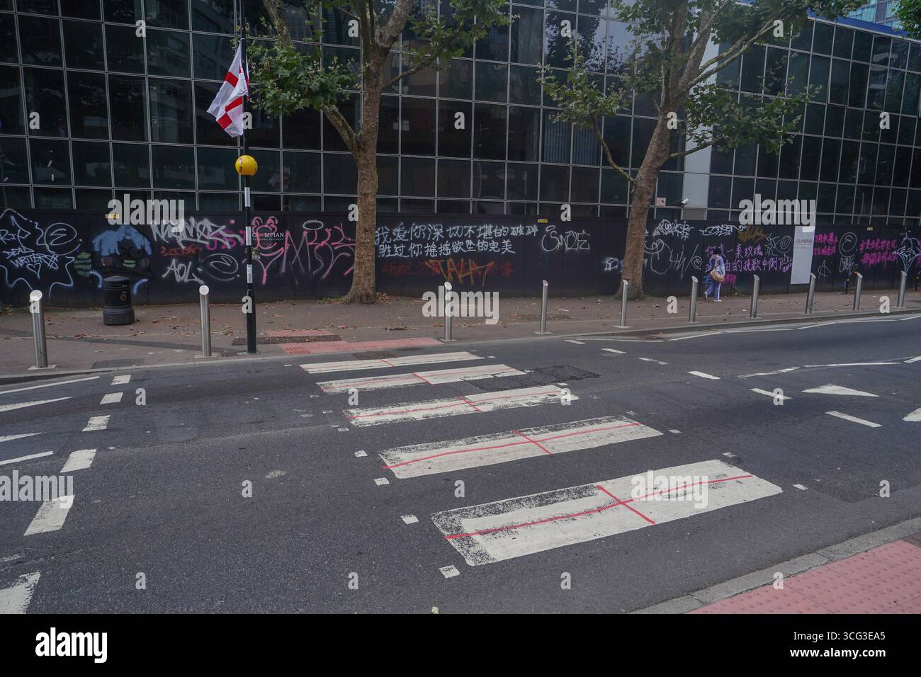 London, UK. 26 August 2025. A zebra crossing in canary Wharf, Tower ...
