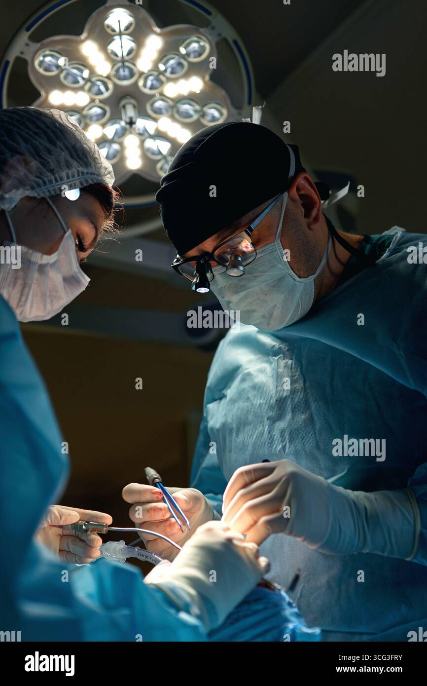 Surgeons uniform perform operation hi-res stock photography and images ...