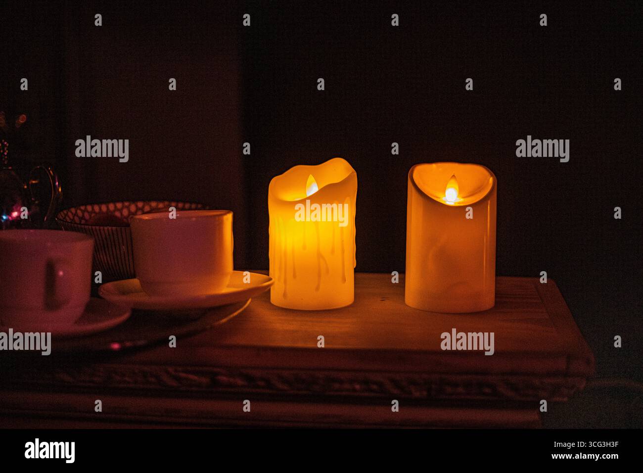 turning on the candle light on the table. Romantic dinner. All Saints' Day. Halloween. Fire Day ...