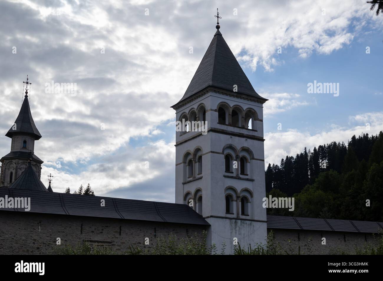 a low-angle shot of the iconic Putna Monastery in Romania, featuring ...