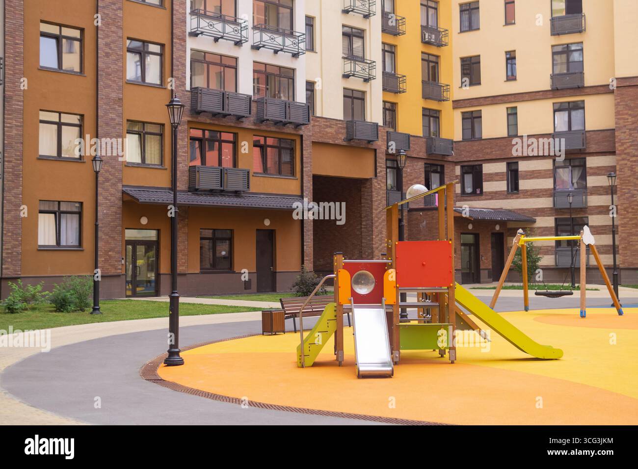 Playground in the courtyard of a residential building Stock Photo - Alamy