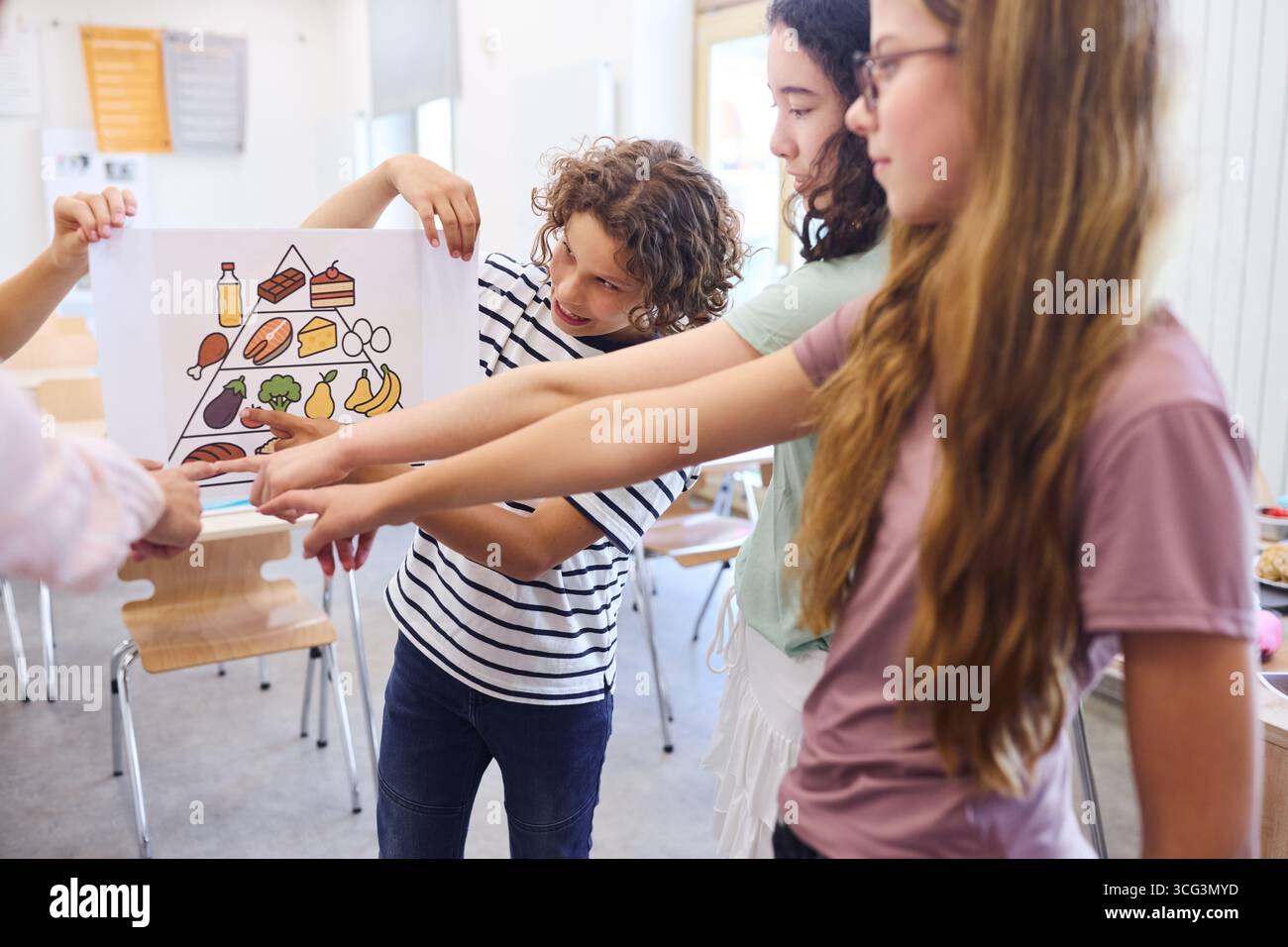 A group of students discuss proper nutrition in an educational activity ...