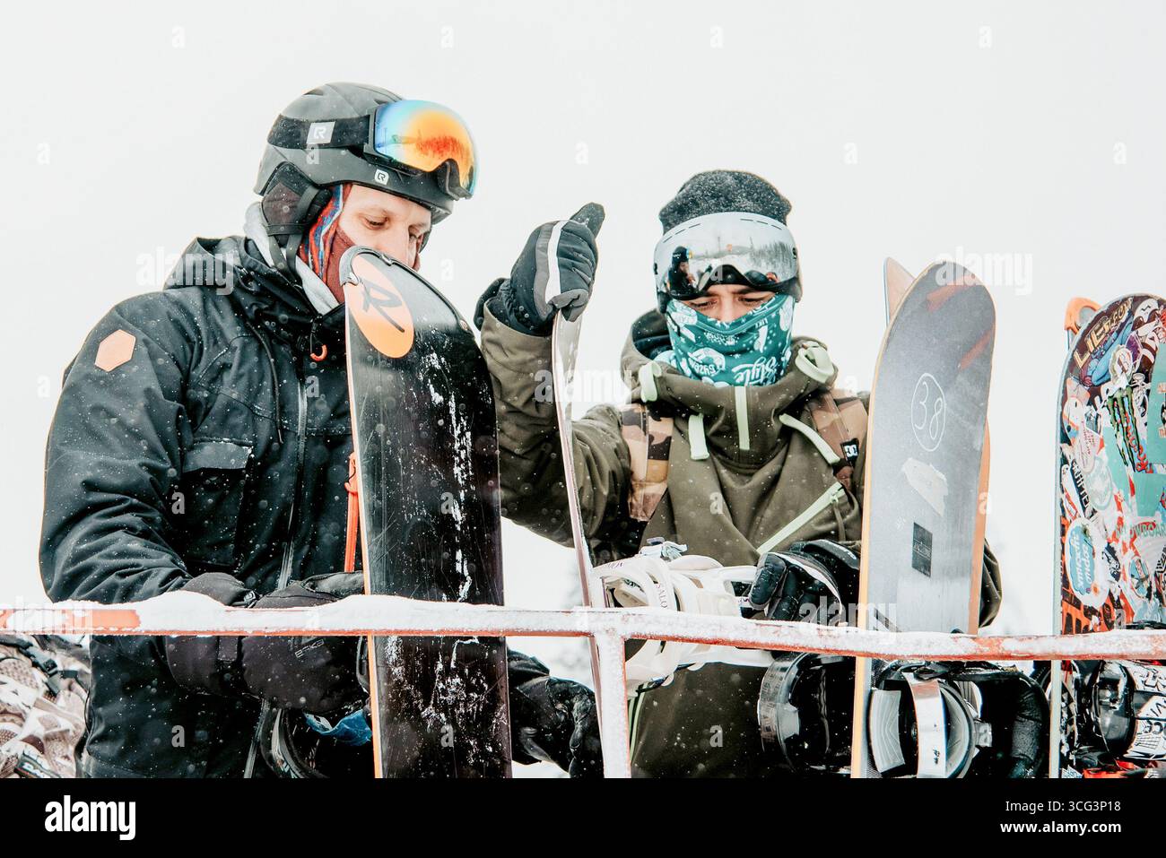 Sheregesh, Russia, 4 January 2021, Snowboarder, skier loading ski ...