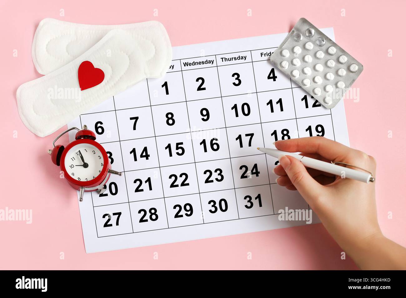 Menstruation calendar with pads, alarm clock, hormonal contraceptive ...