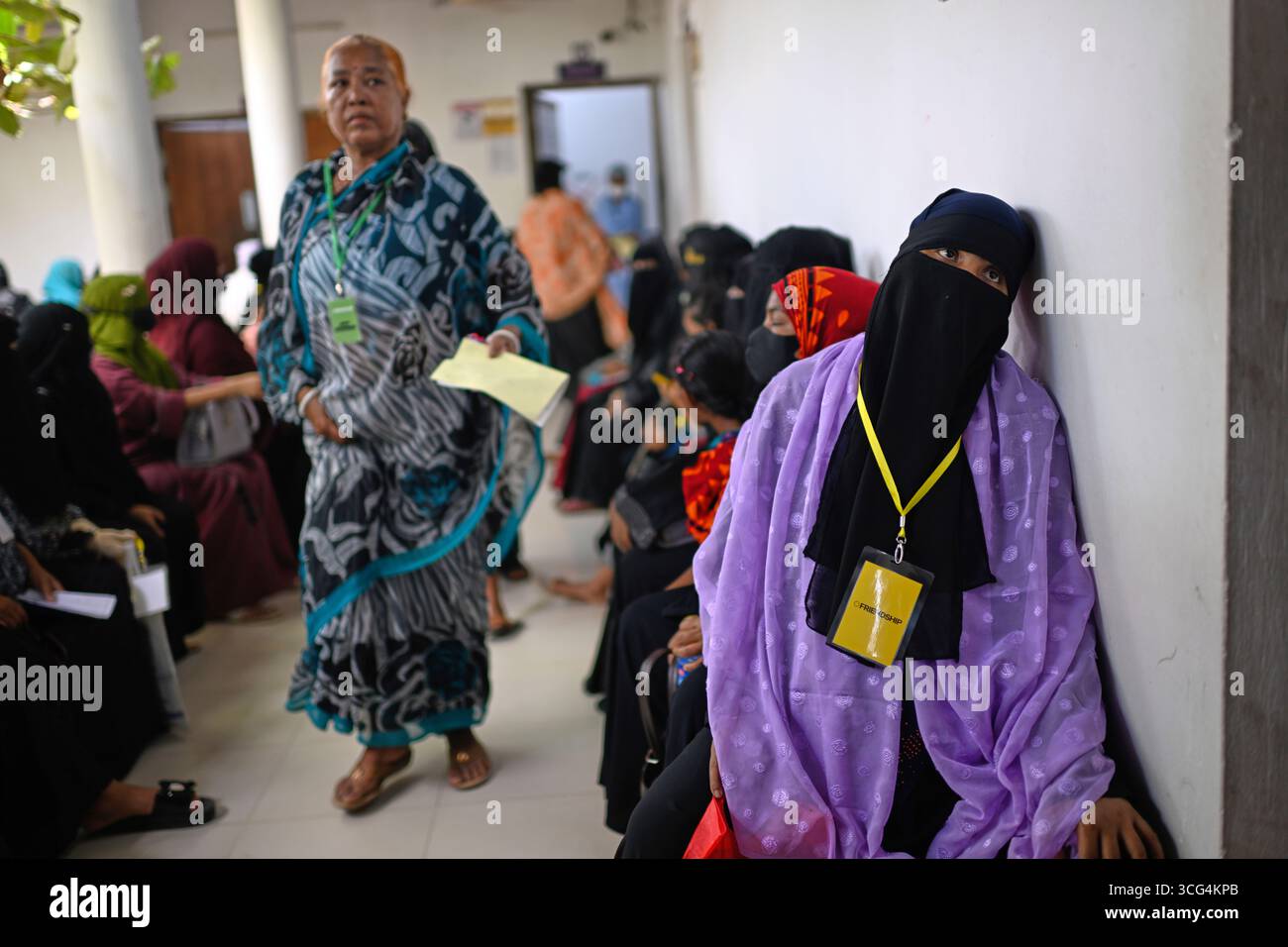 Rohingya refugees wait for medical treatment at a hospital in the ...