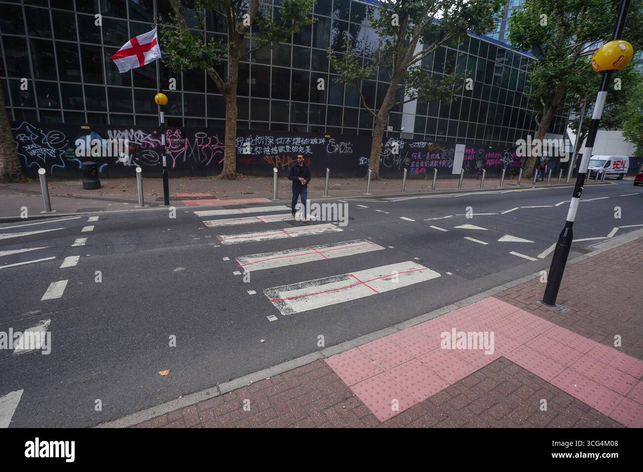 London, UK. 26 August 2025. A zebra crossing in canary Wharf, Tower ...