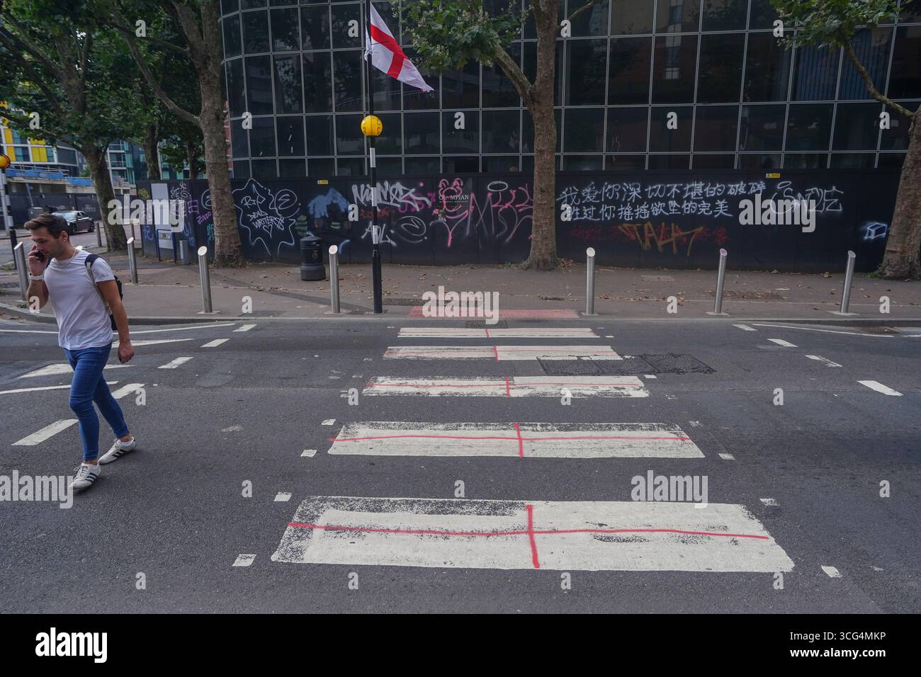 London, UK. 26 August 2025. A zebra crossing in canary Wharf, Tower ...